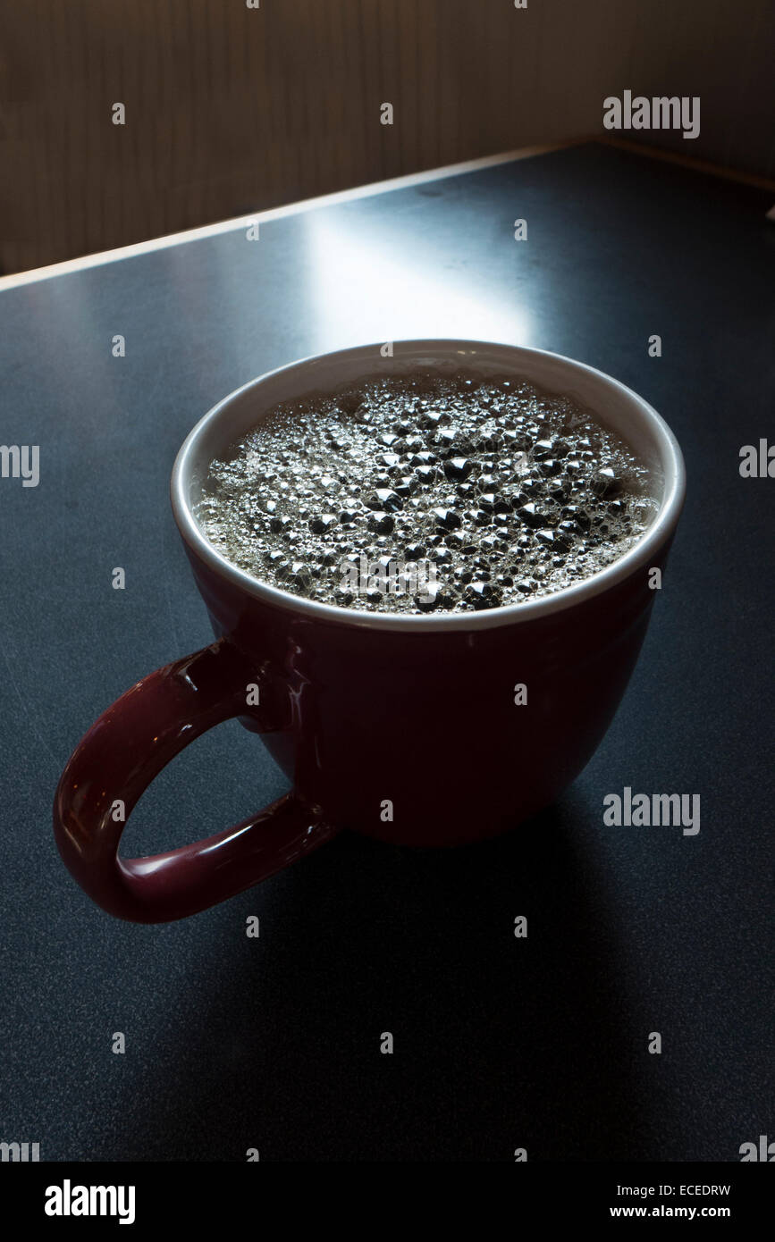 A mug of foaming hot coffee Stock Photo - Alamy