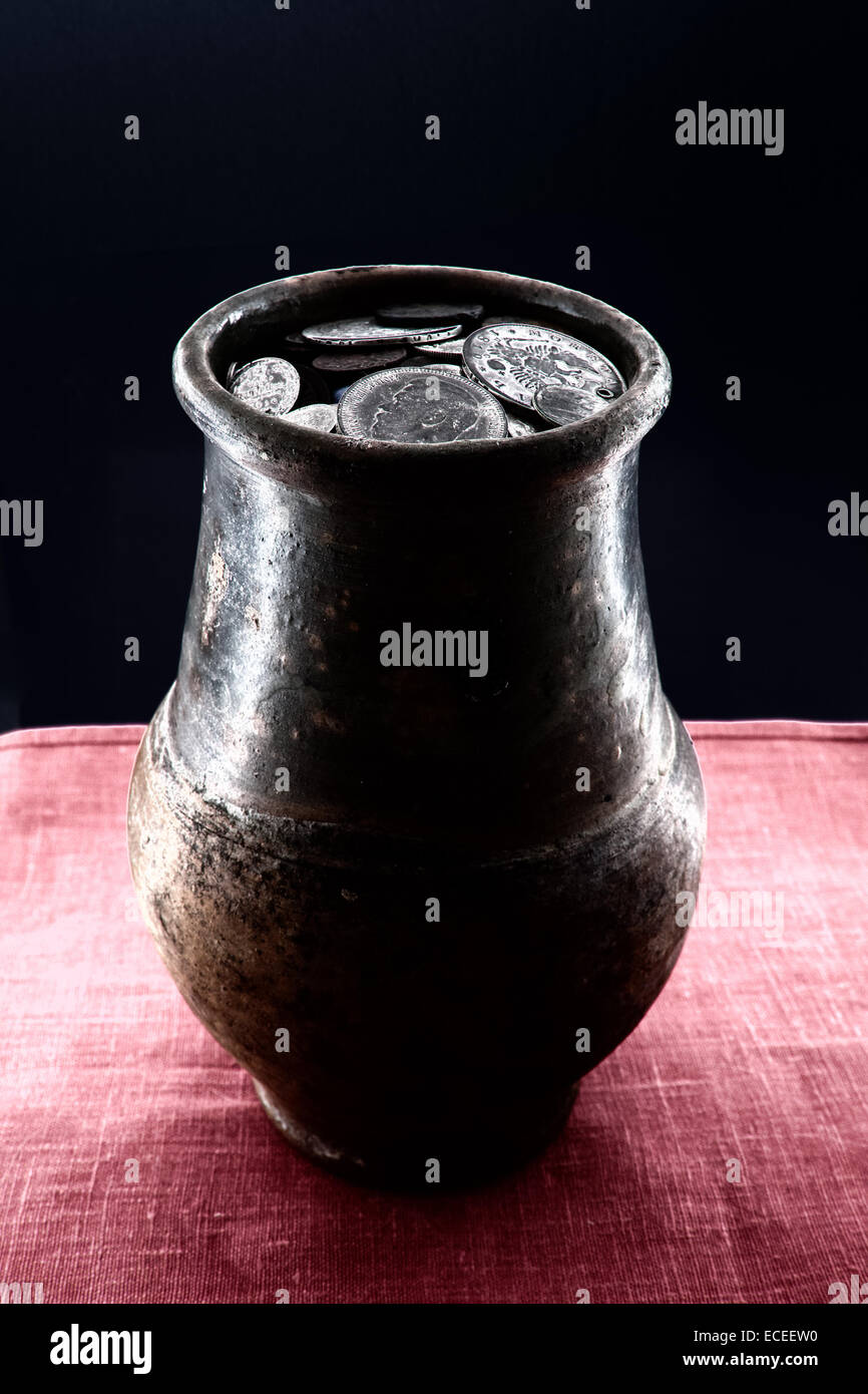 old jug with silver coins Stock Photo - Alamy