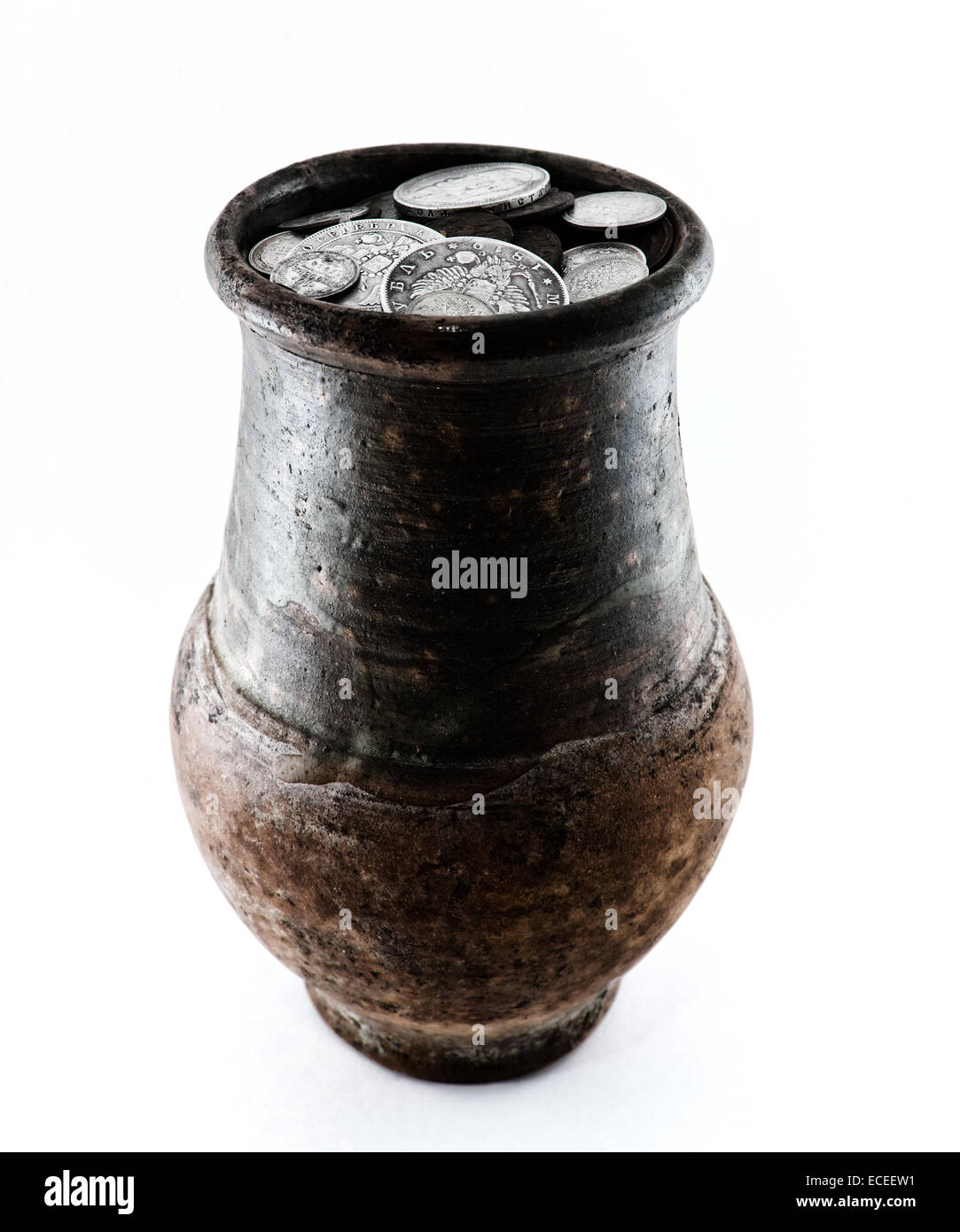 old jug with silver coins Stock Photo - Alamy