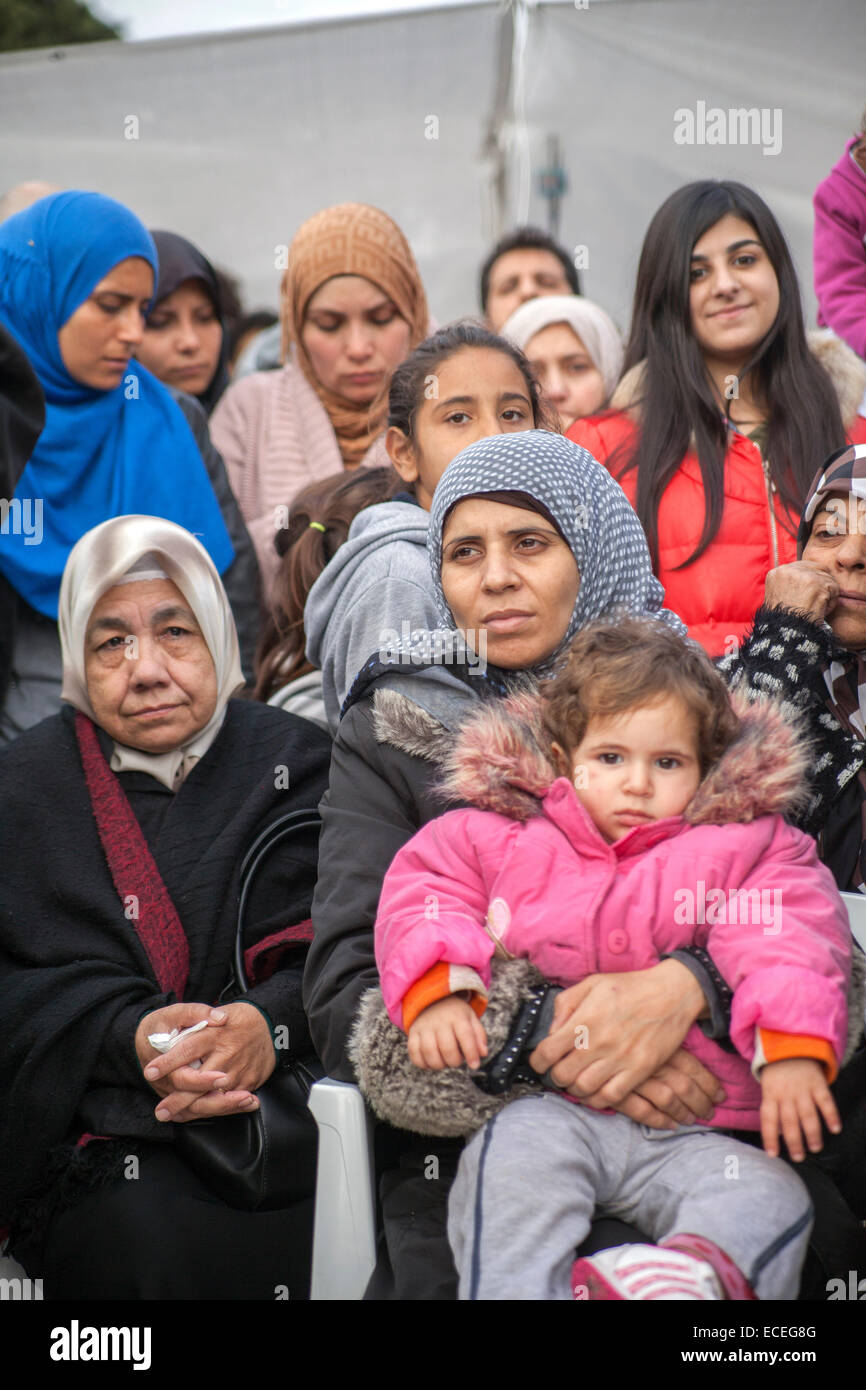 Syrian refugees in Athens. Syrian mother with daughter and other ...