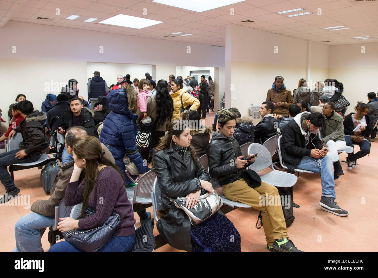 Asylum seekers wait inside the Berlin Central Reception Facility for ...