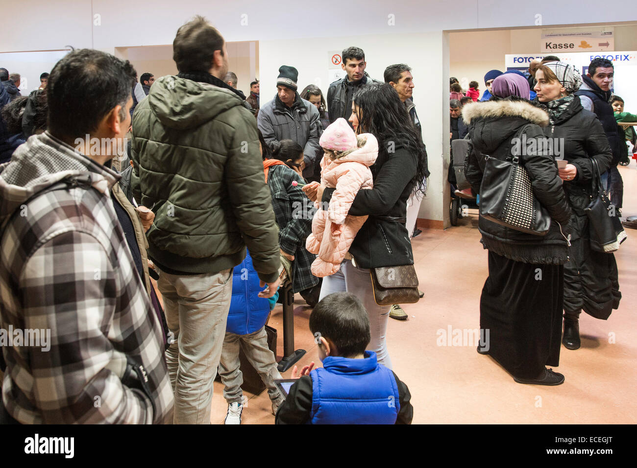 Asylum seekers wait inside the Berlin Central Reception Facility for ...