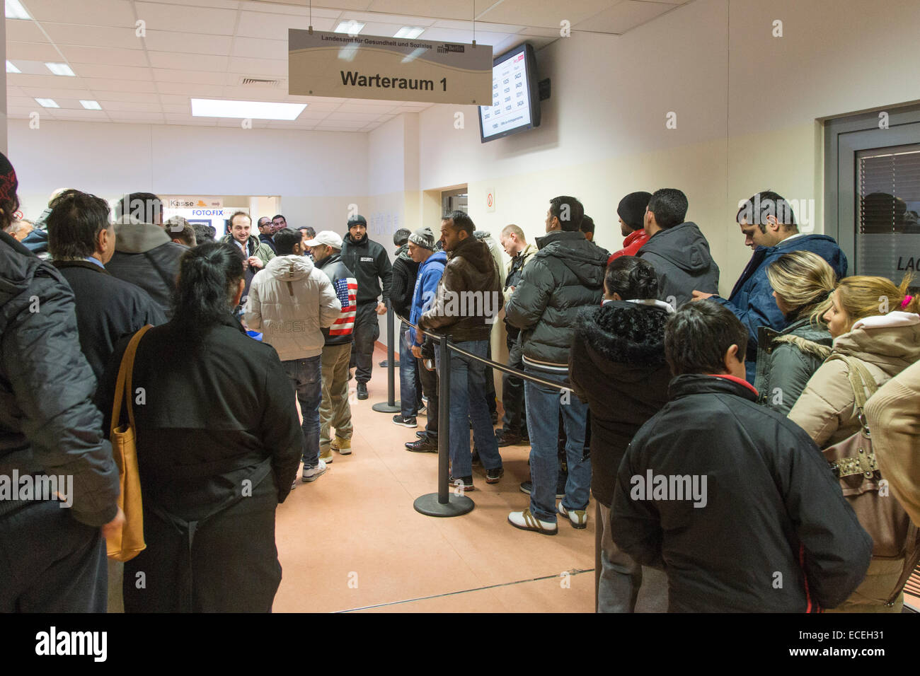 Asylum seekers wait inside the Berlin Central Reception Facility for ...