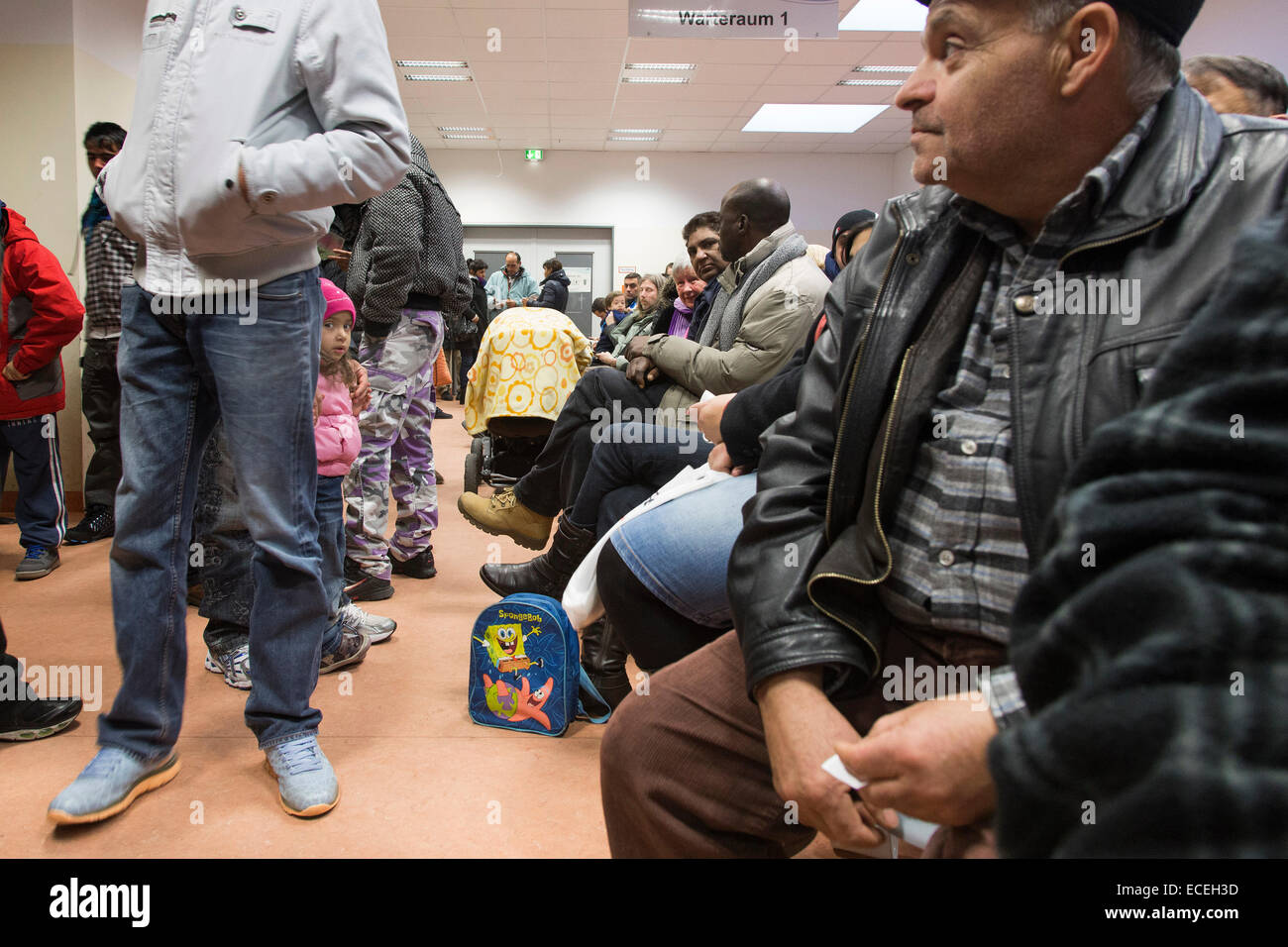 Asylum seekers wait inside the Berlin Central Reception Facility for ...