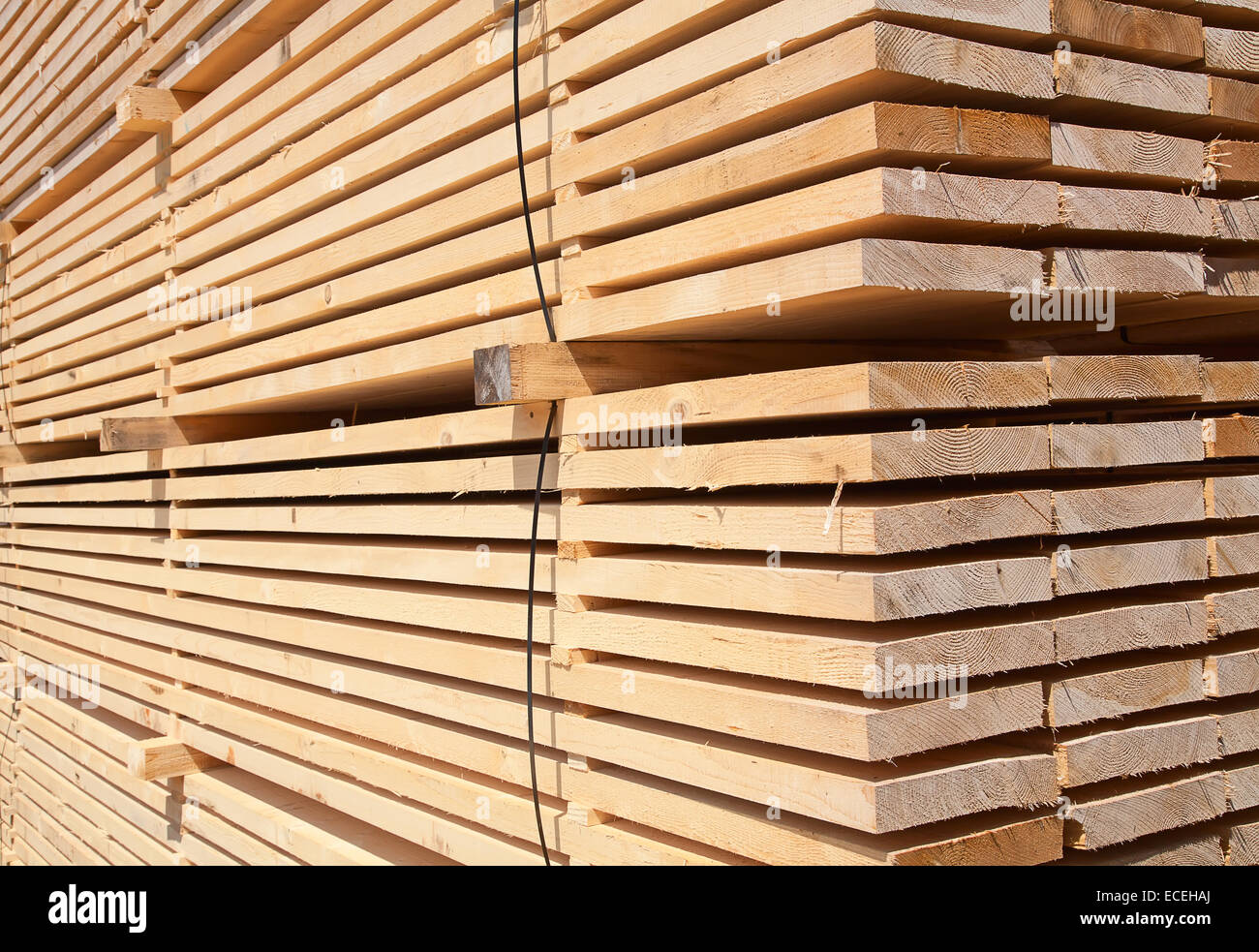 Stack of new wooden studs at the lumber yard Stock Photo - Alamy
