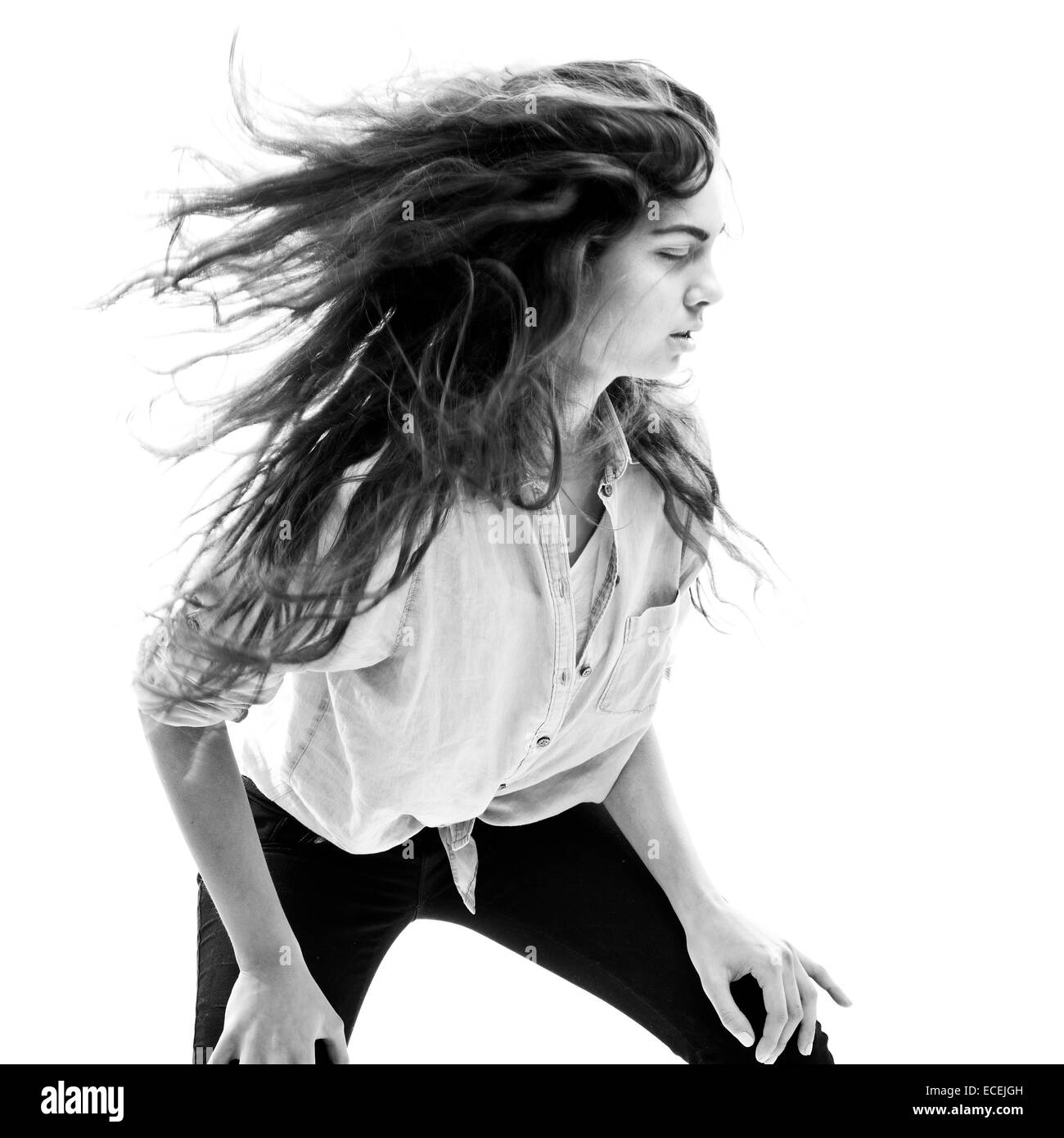 Portrait of a young woman with hair in the wind Stock Photo - Alamy