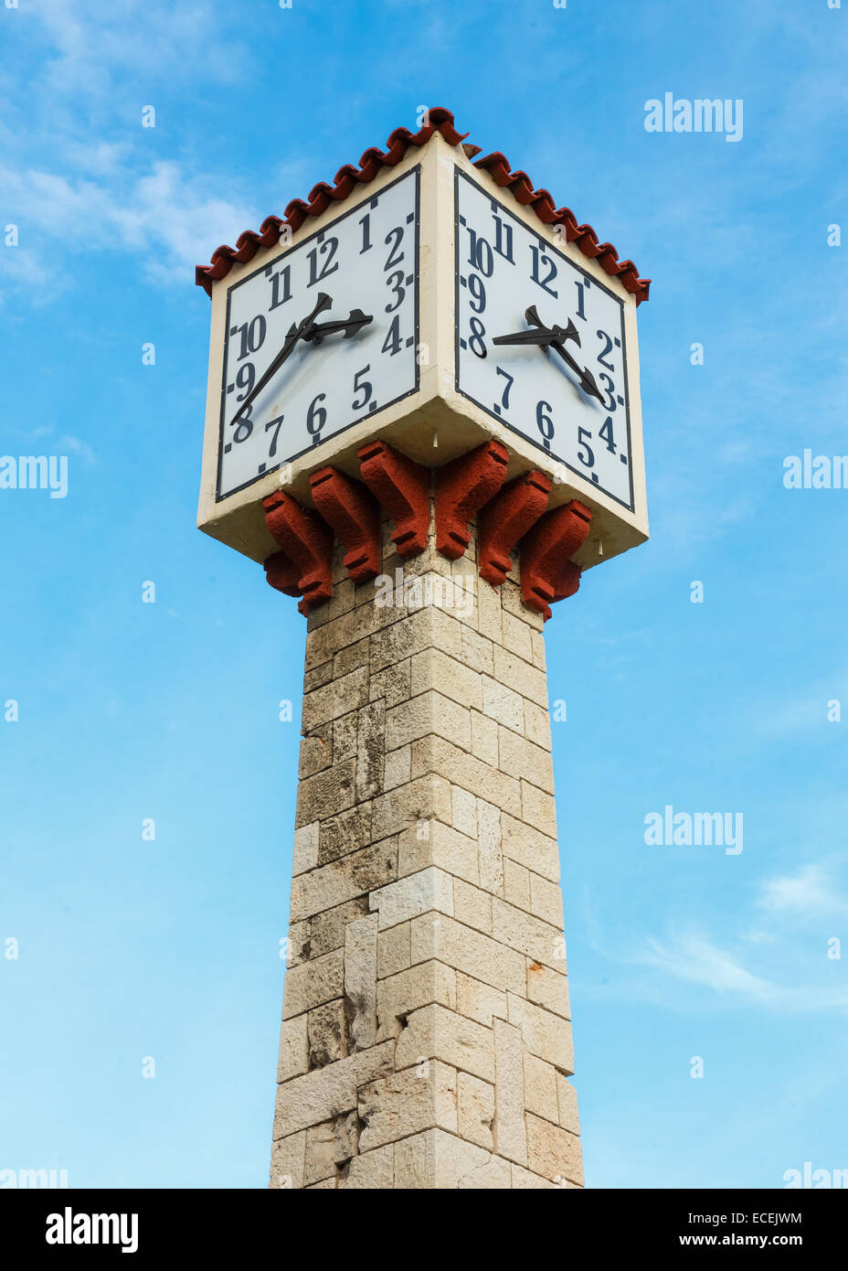 Old tower clock in Piraeus, Greece with blue sky as a background Stock ...