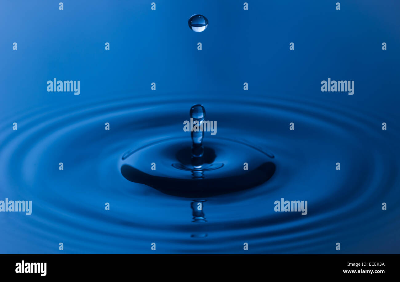 Water droplet hitting water Stock Photo - Alamy