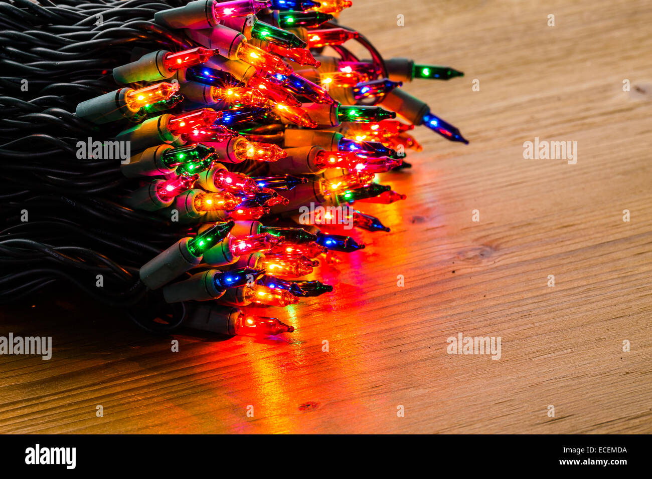 String of multicolor Christmas lights with green wiring Stock Photo - Alamy