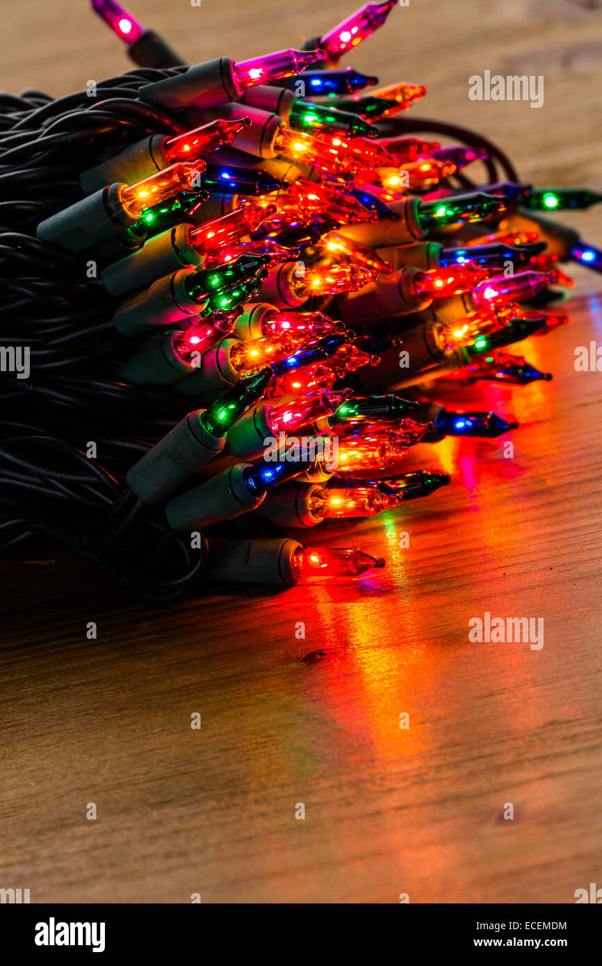 String of multicolor Christmas lights with green wiring Stock Photo - Alamy