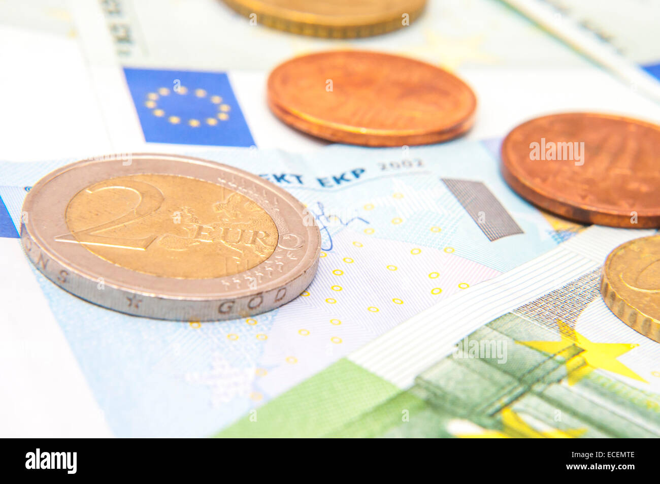 Money euro coins and banknotes on a white background Stock Photo - Alamy