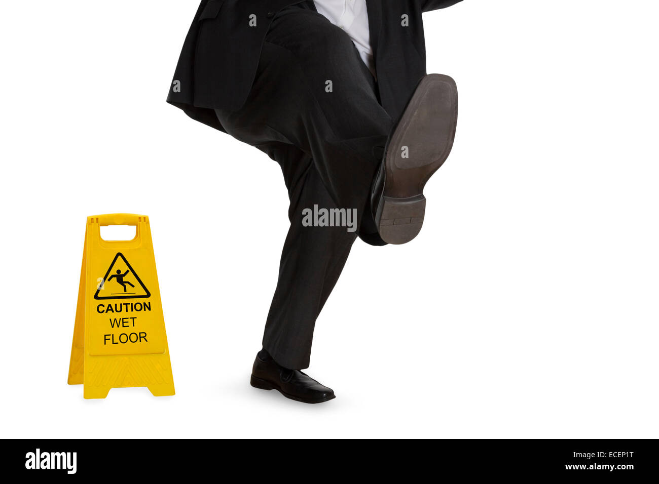 Man in suit slipping on wet floor with warning sign isolated on white ...