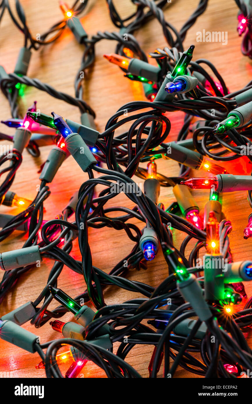 String of multicolor Christmas lights with green wiring Stock Photo - Alamy
