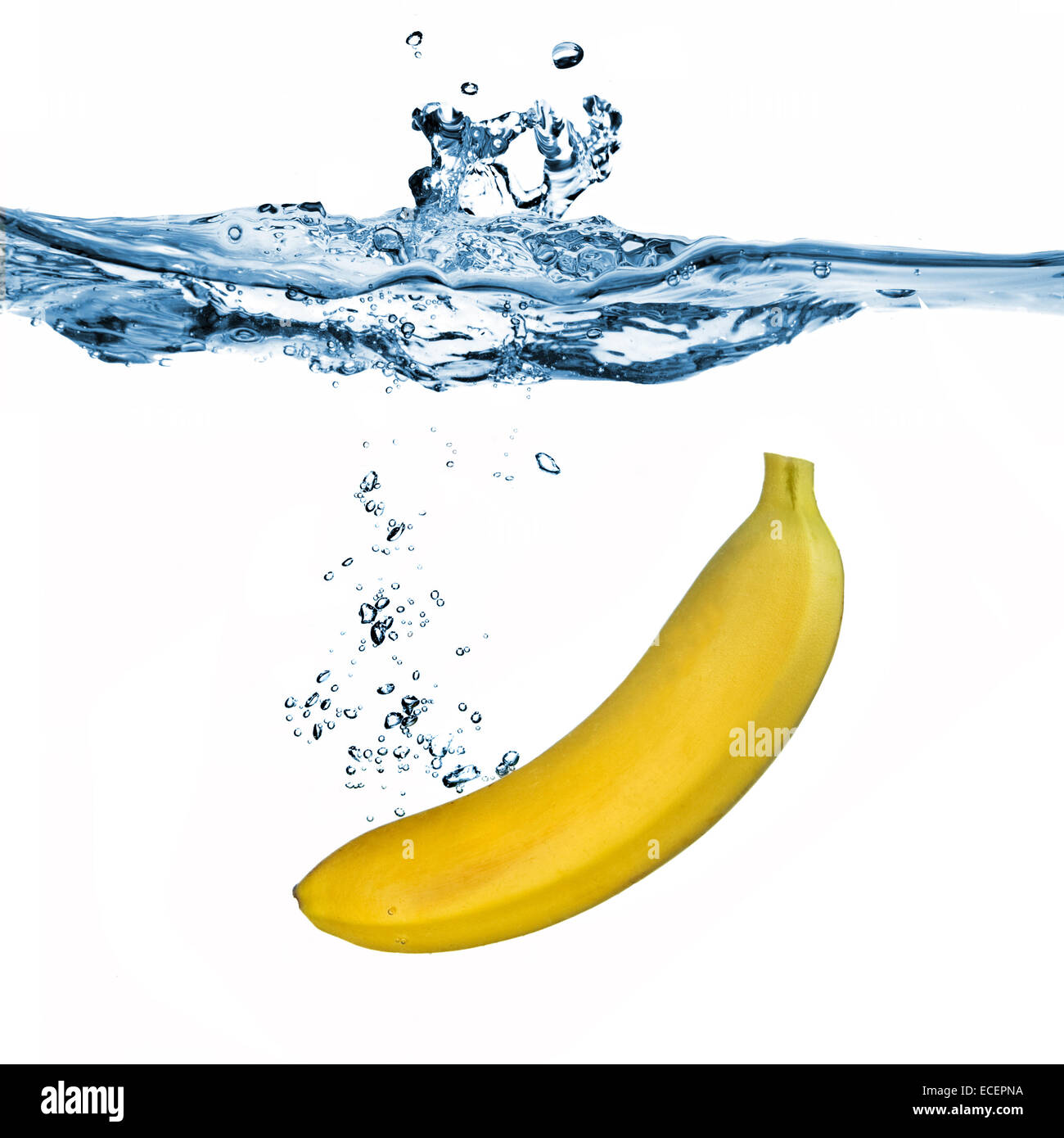 banana dropped into water isolated on white Stock Photo - Alamy