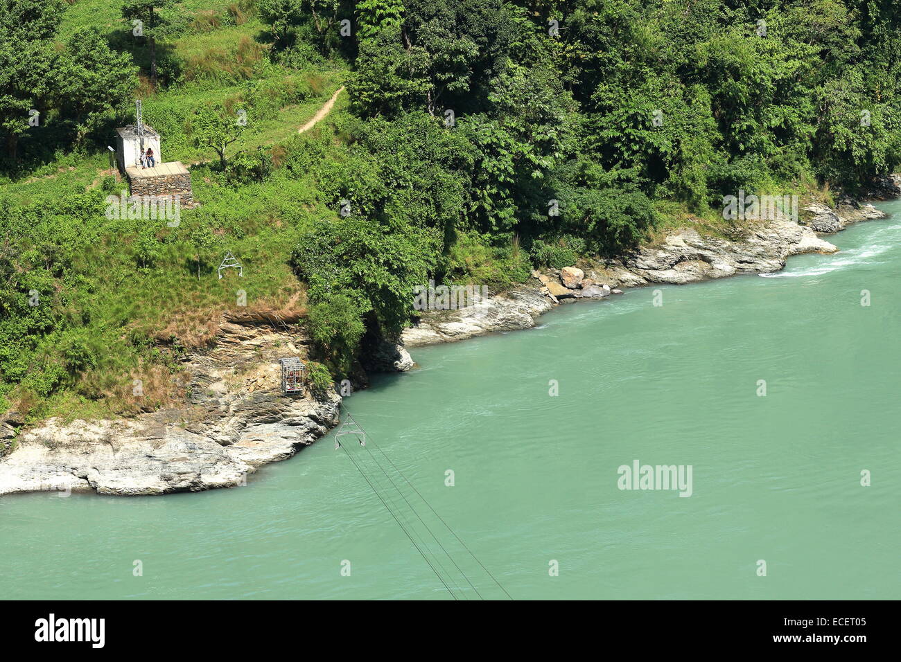 TRISHULI RIVER, NEPAL - OCTOBER 13: Tuin technology cable car crosses ...