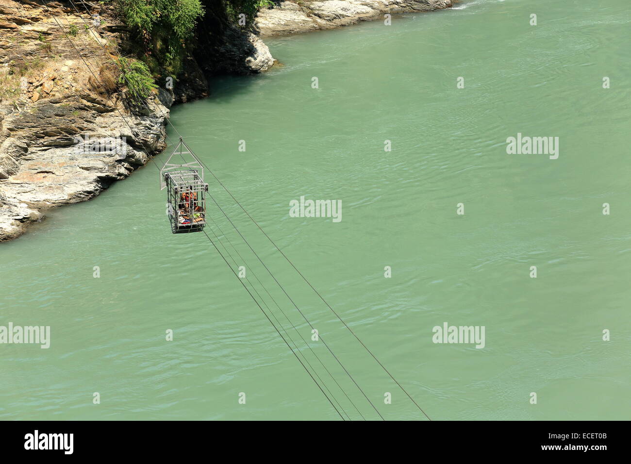 TRISHULI RIVER, NEPAL - OCTOBER 13: Tuin technology cable car crosses ...