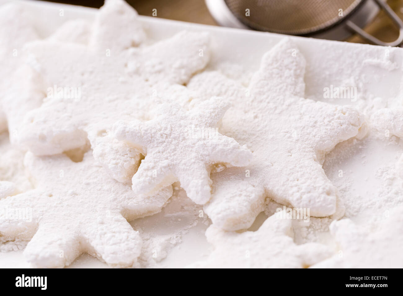 Making marshmallows in shapes of snowflakes for garnish hot chocolate ...