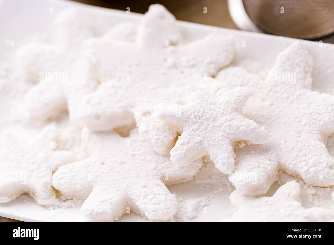 Making marshmallows in shapes of snowflakes for garnish hot chocolate ...