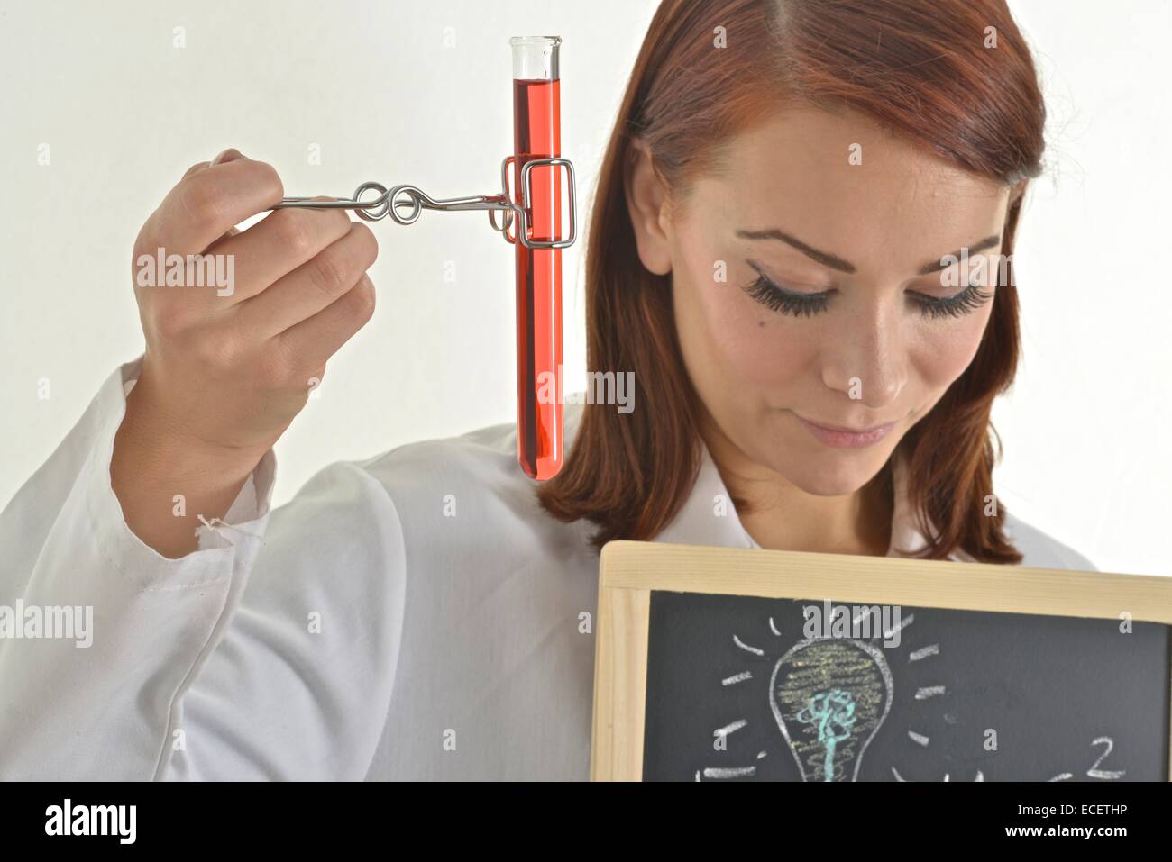 Woman holding a beaker hi-res stock photography and images - Alamy