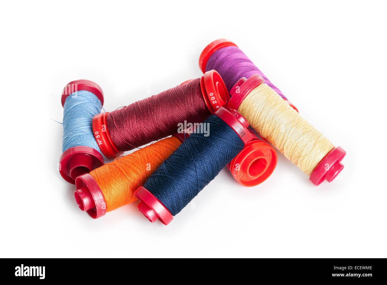 Bobbins of thread isolated on white background Stock Photo - Alamy