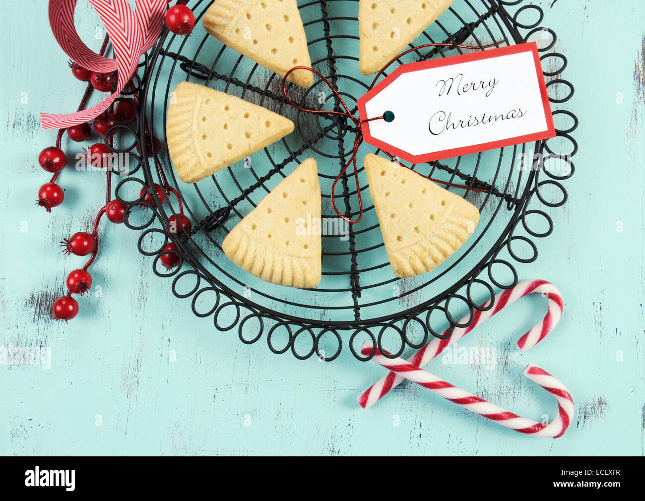 Traditional Christmas shortbread triangle shape cookies on vintage ...