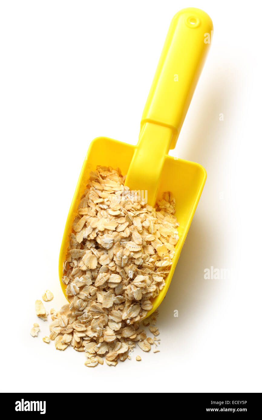 Dry oats cereal in yellow spoon Stock Photo - Alamy
