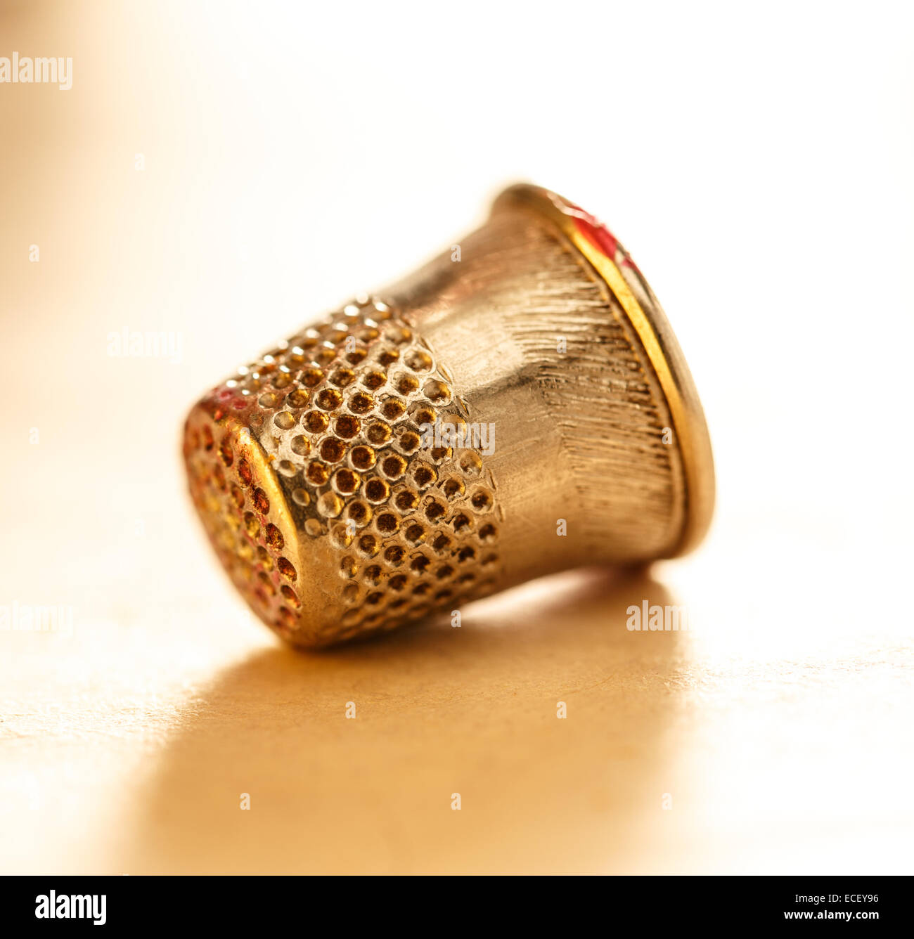 Metal sewing thimble in toning Stock Photo - Alamy