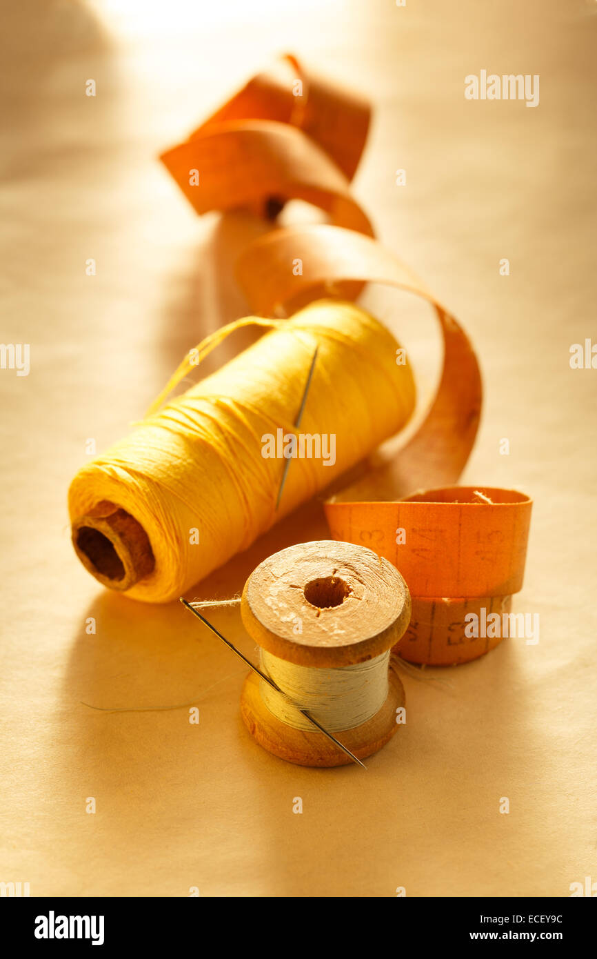 Sewing items and meter on paper Stock Photo - Alamy
