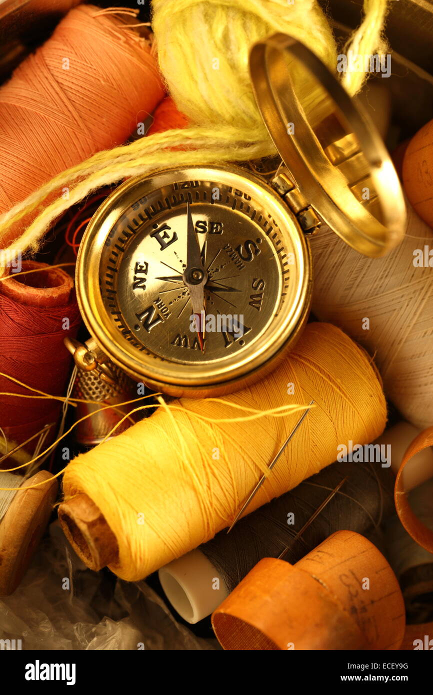 Sewing items and black compass Stock Photo - Alamy