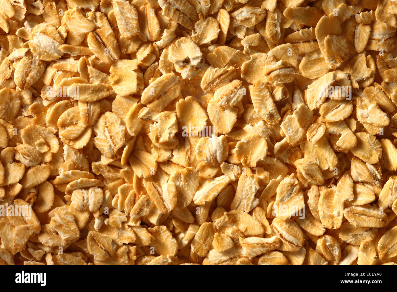 Dry oats cereal as background Stock Photo - Alamy