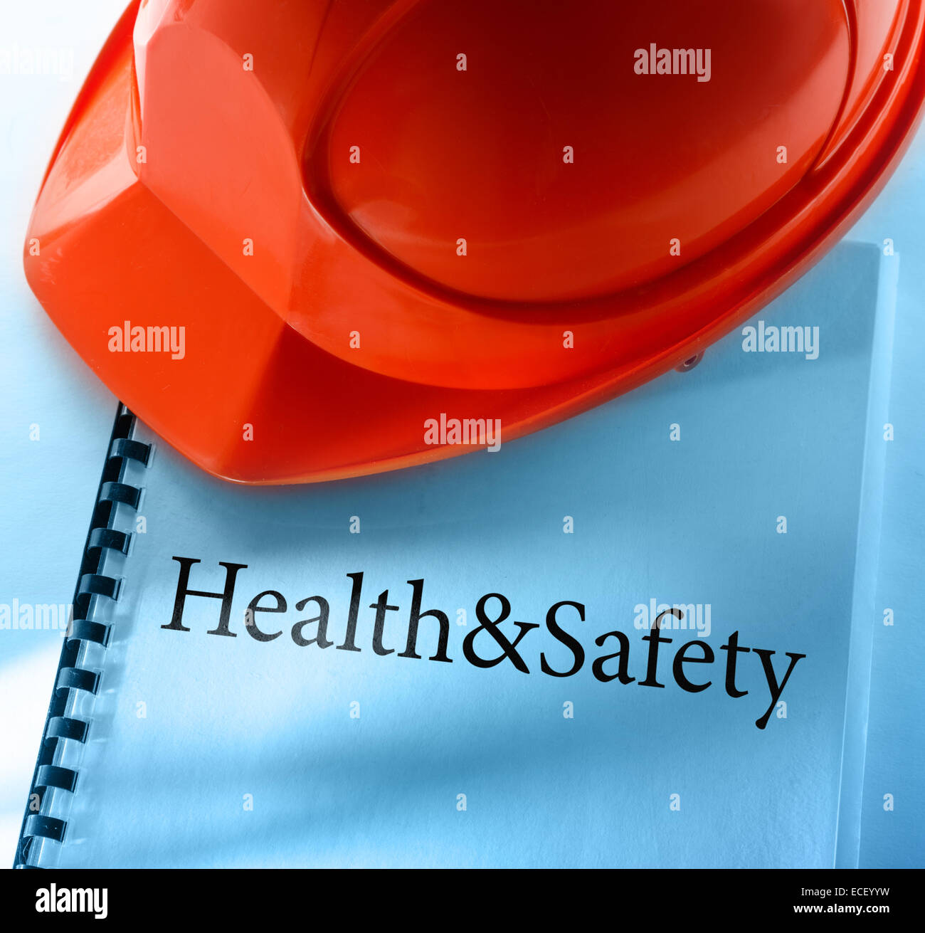 Health and safety with red helmet Stock Photo - Alamy