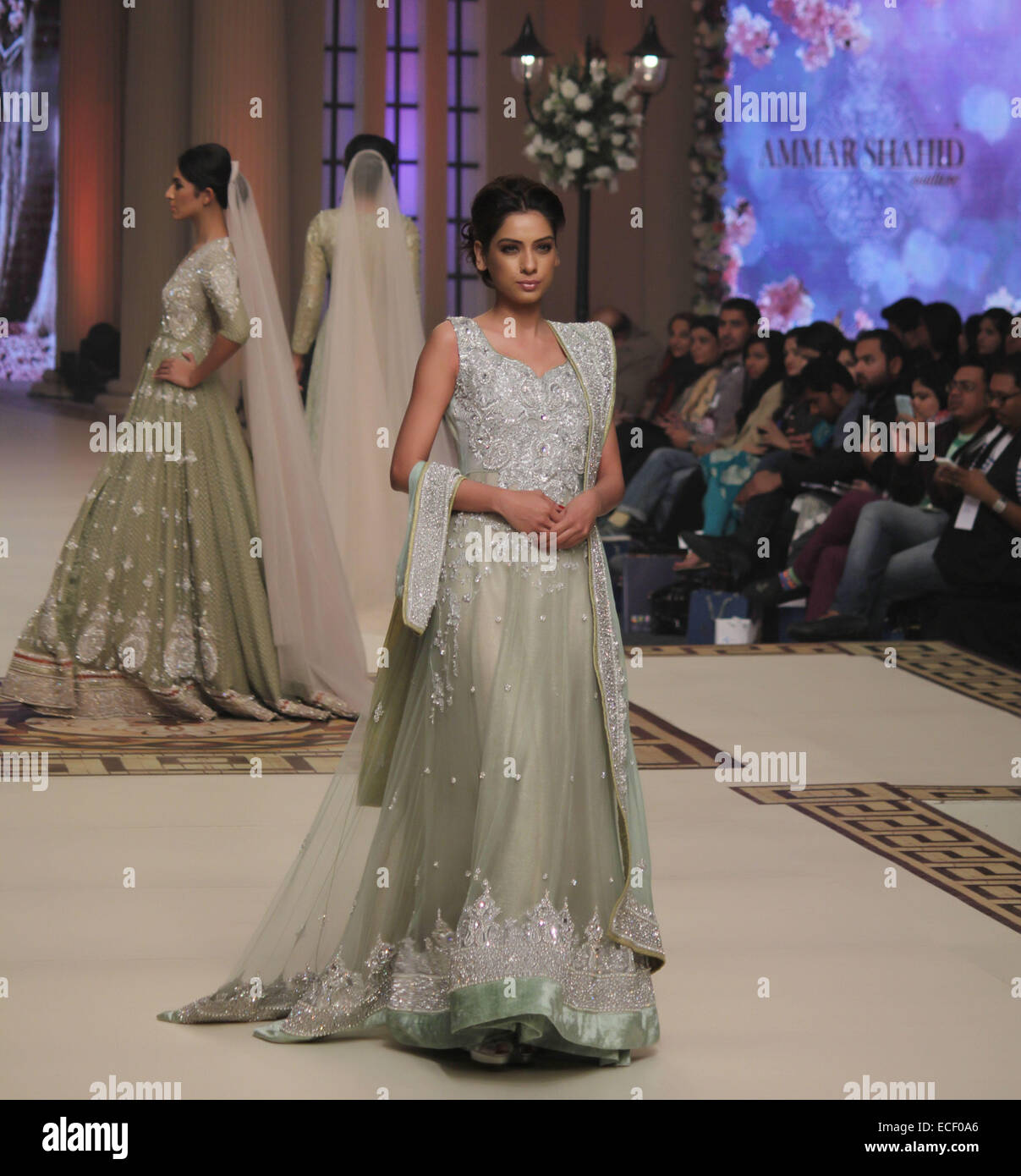 Pakistani model presents creations by Pakistani designers Aisha Imran ...