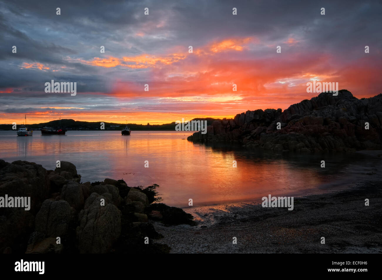A stunning sunset over the Isle of Iona looking from the Isle of Mull ...
