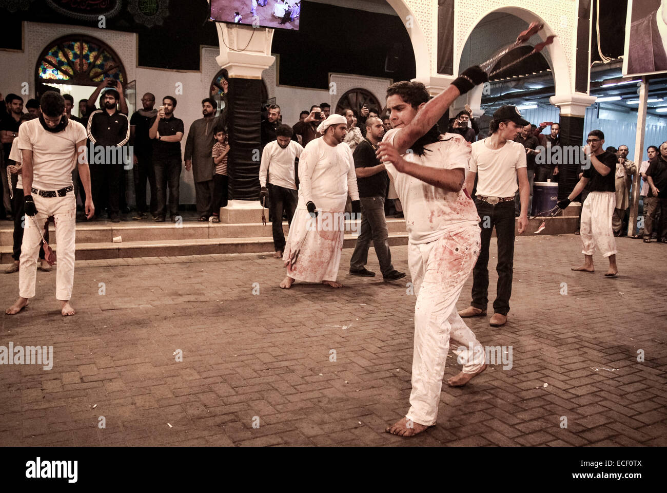 Male Shia Muslims take part in ceremonial chest beating parade as a ...