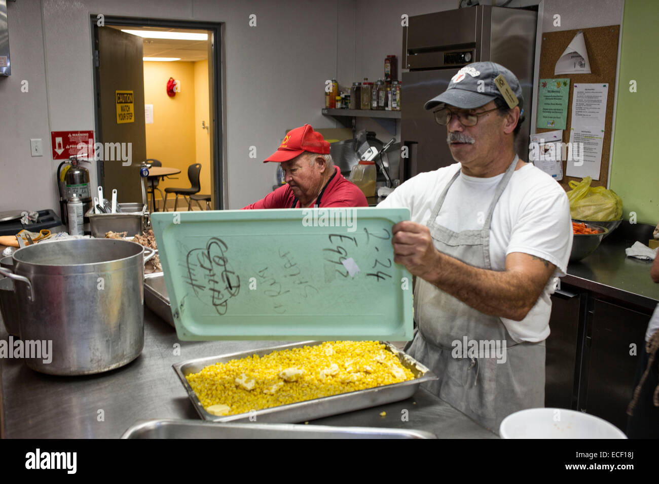 Portraits of the visitors and volunteers of the community kitchen at an ...