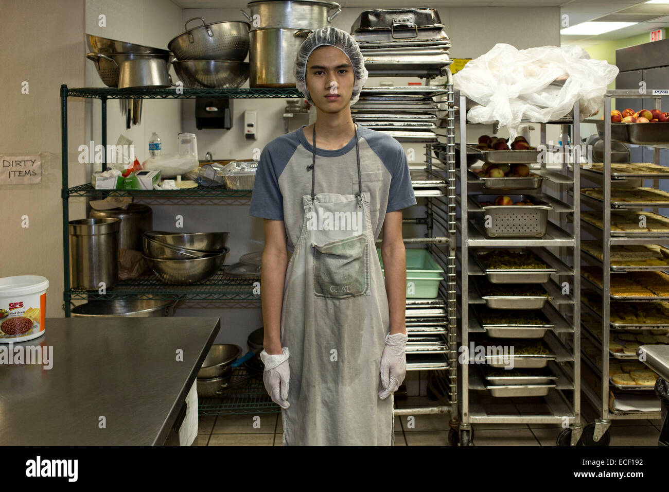 Portraits of the visitors and volunteers of the community kitchen at an ...