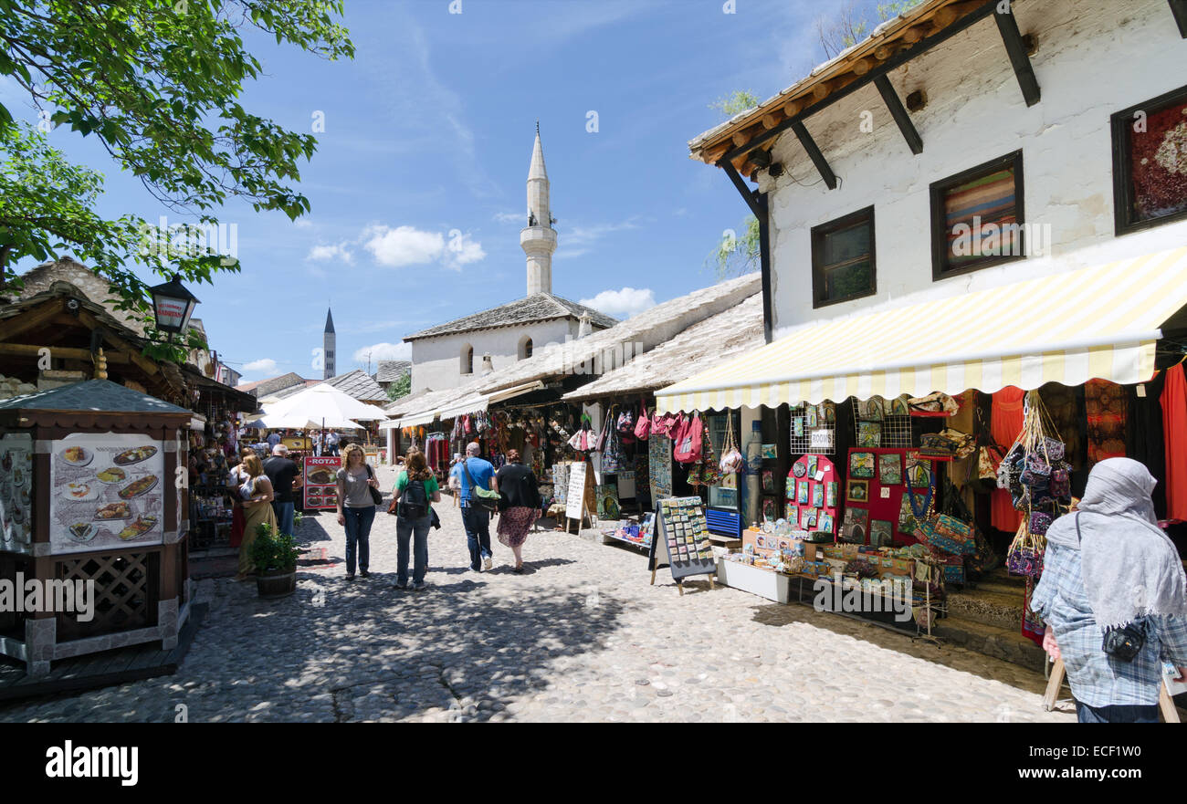 MOSTAR, BOSNIA AND HERZEGOVINA - MAY 18, 2013: Tourists look at the ...