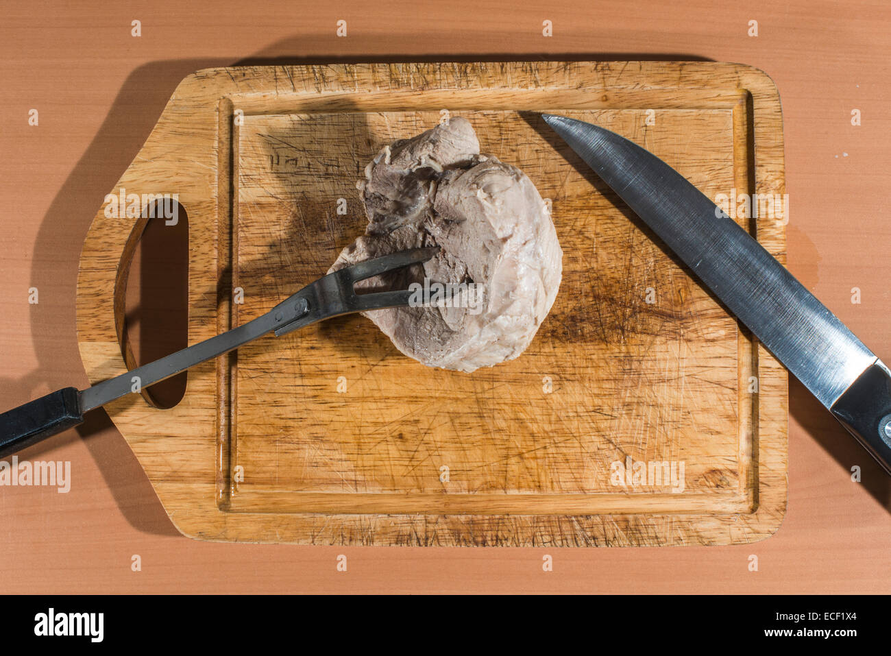 Cutting cooked meat on wood Stock Photo - Alamy