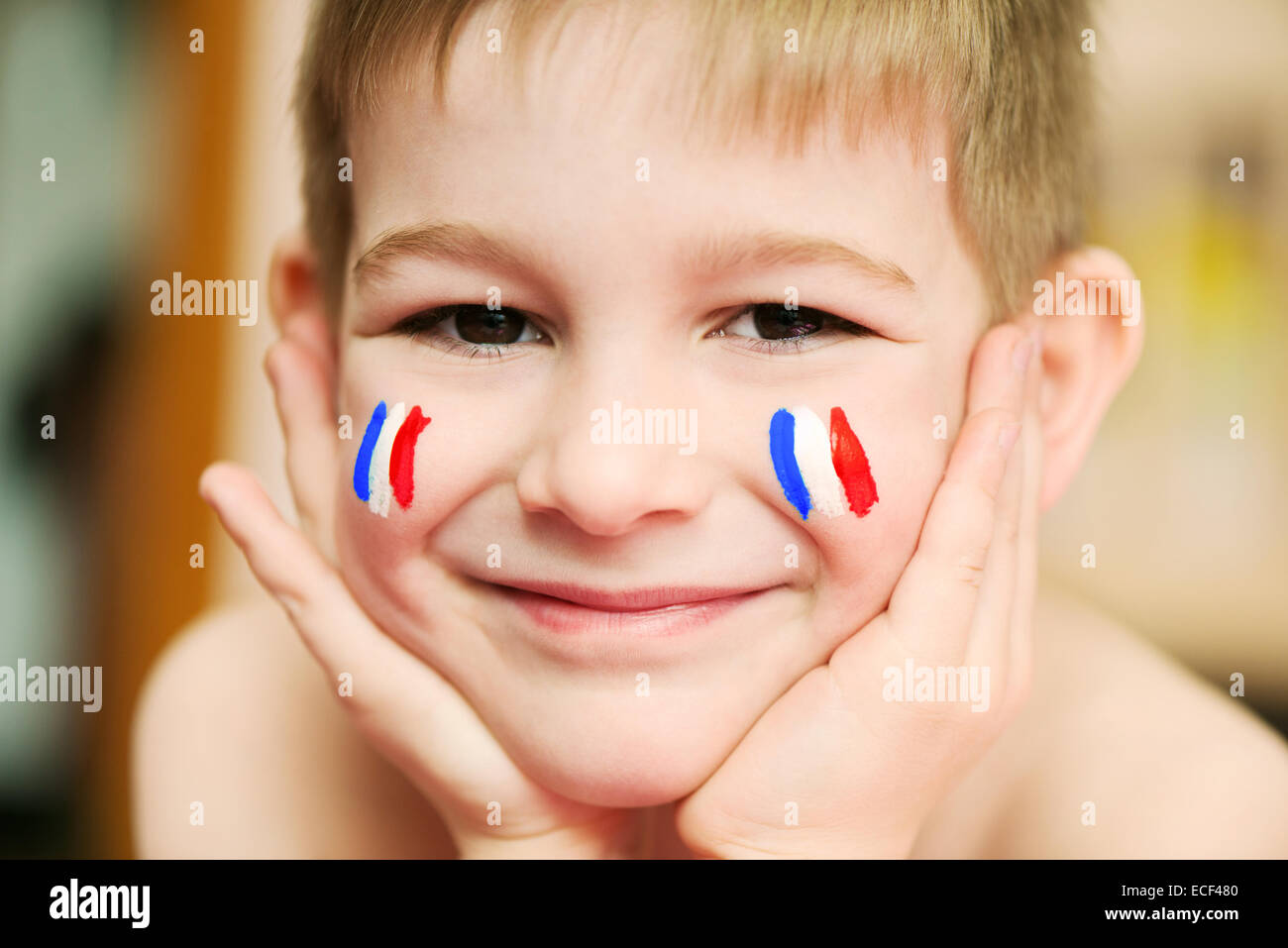 Cute little boy with European flags on cheeks Stock Photo - Alamy