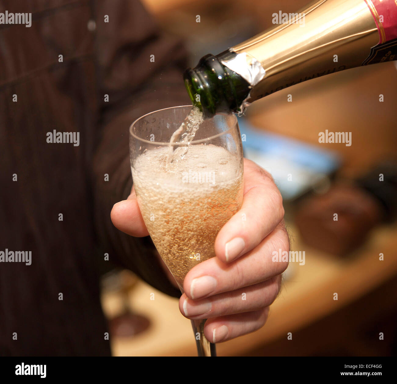 Glasses of Champagne being poured Stock Photo - Alamy
