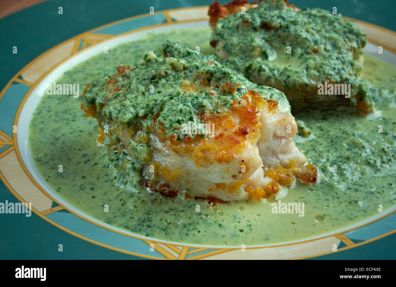 Merluza en salsa verde - fried fish with green sauce Stock Photo - Alamy