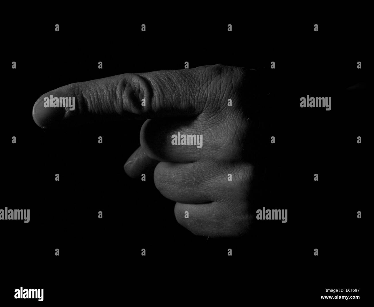 Man's hand pointing on black background Stock Photo - Alamy