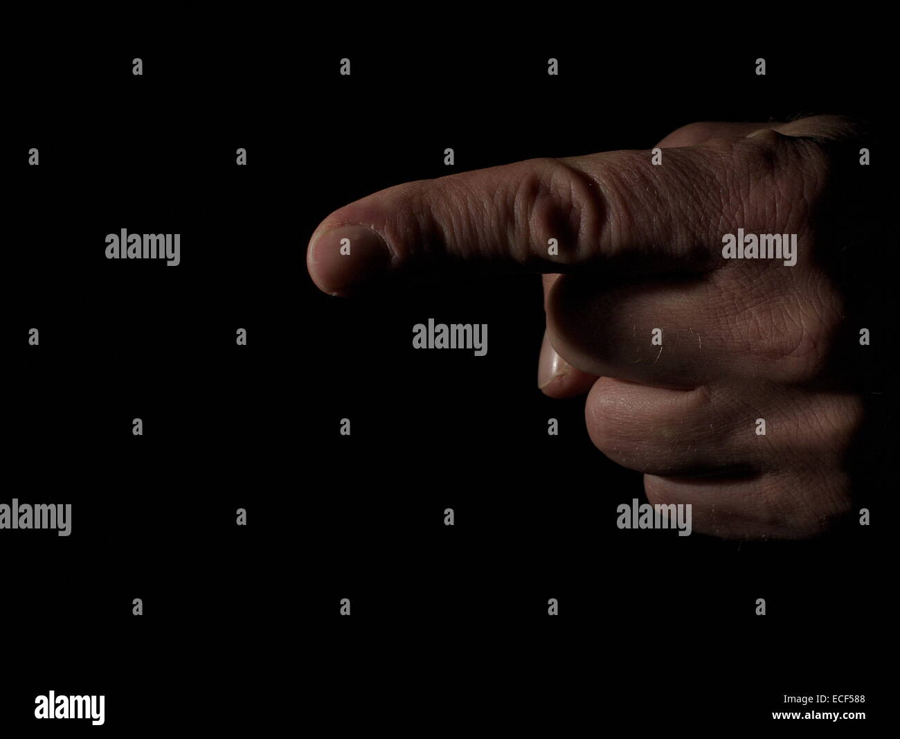 Man's hand pointing on black background Stock Photo - Alamy