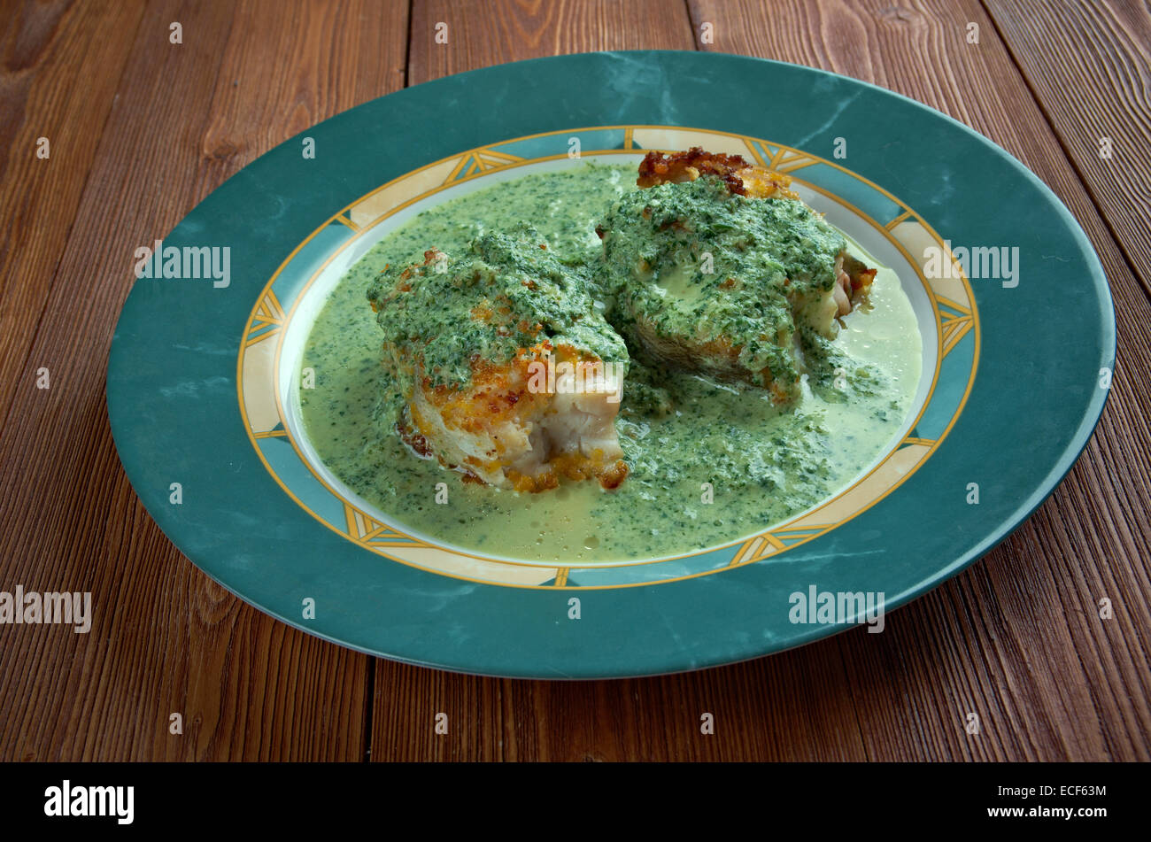 Merluza en salsa verde - fried fish with green sauce Stock Photo - Alamy