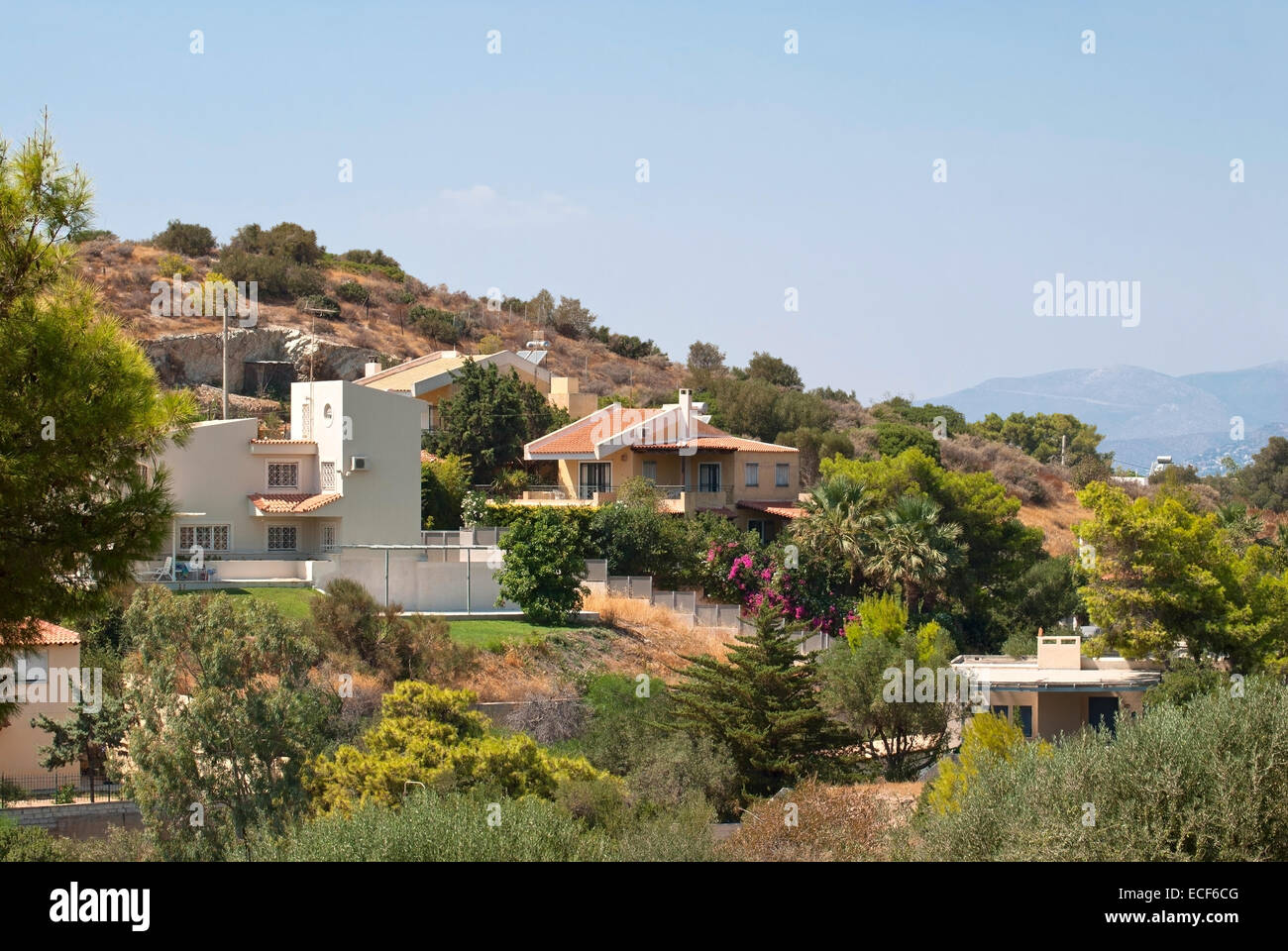 Greek village Anavisos, spread out on the mountainside on a bright ...