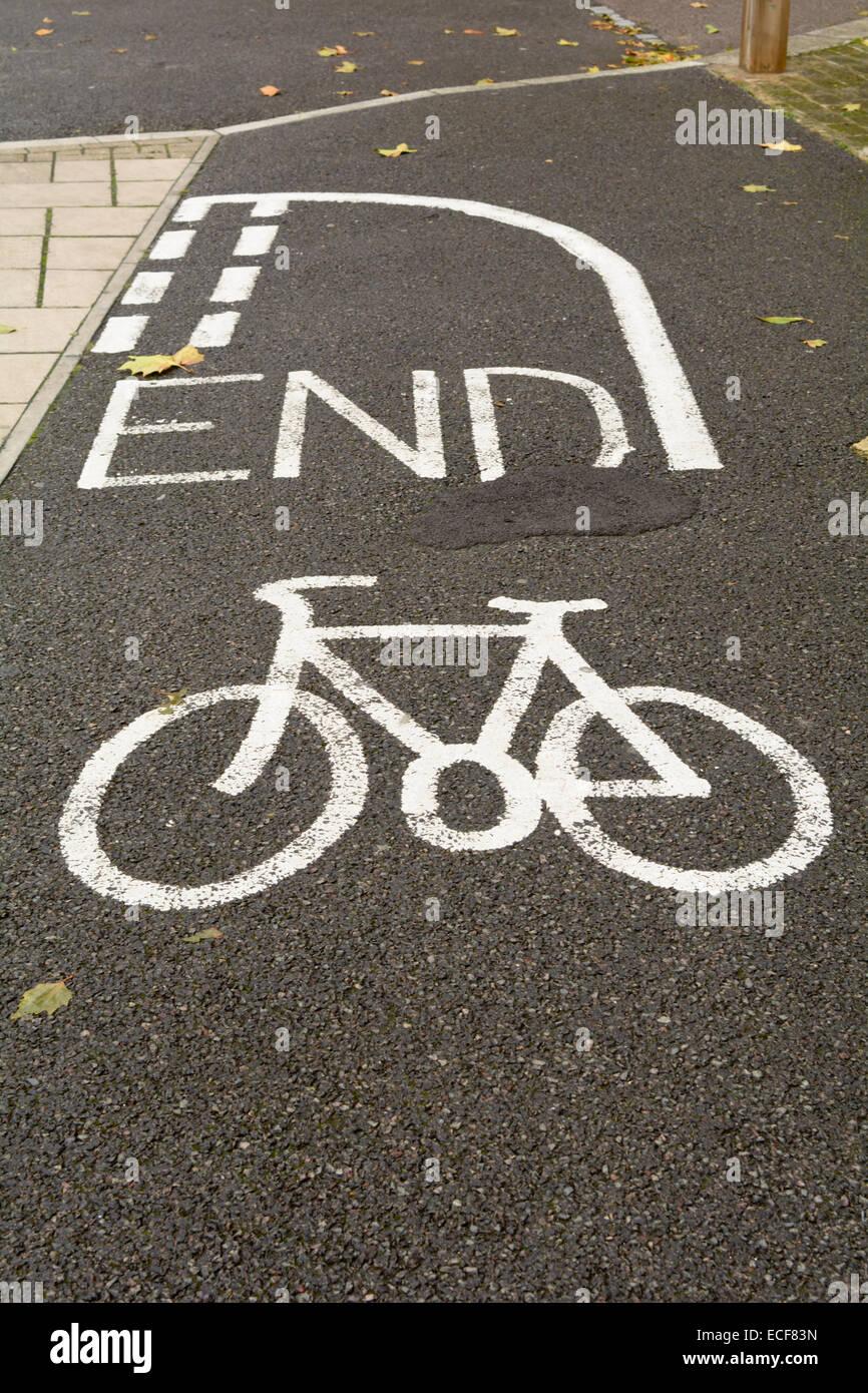 End of cycle lane with bike symbol on pavement Stock Photo - Alamy
