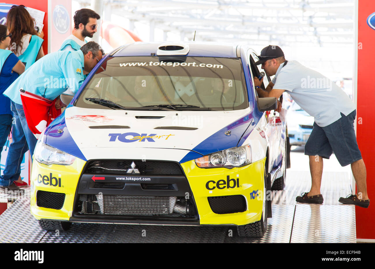 ISTANBUL, TURKEY - JULY 12, 2014: Yigit Timur with Mitsubishi Lancer ...