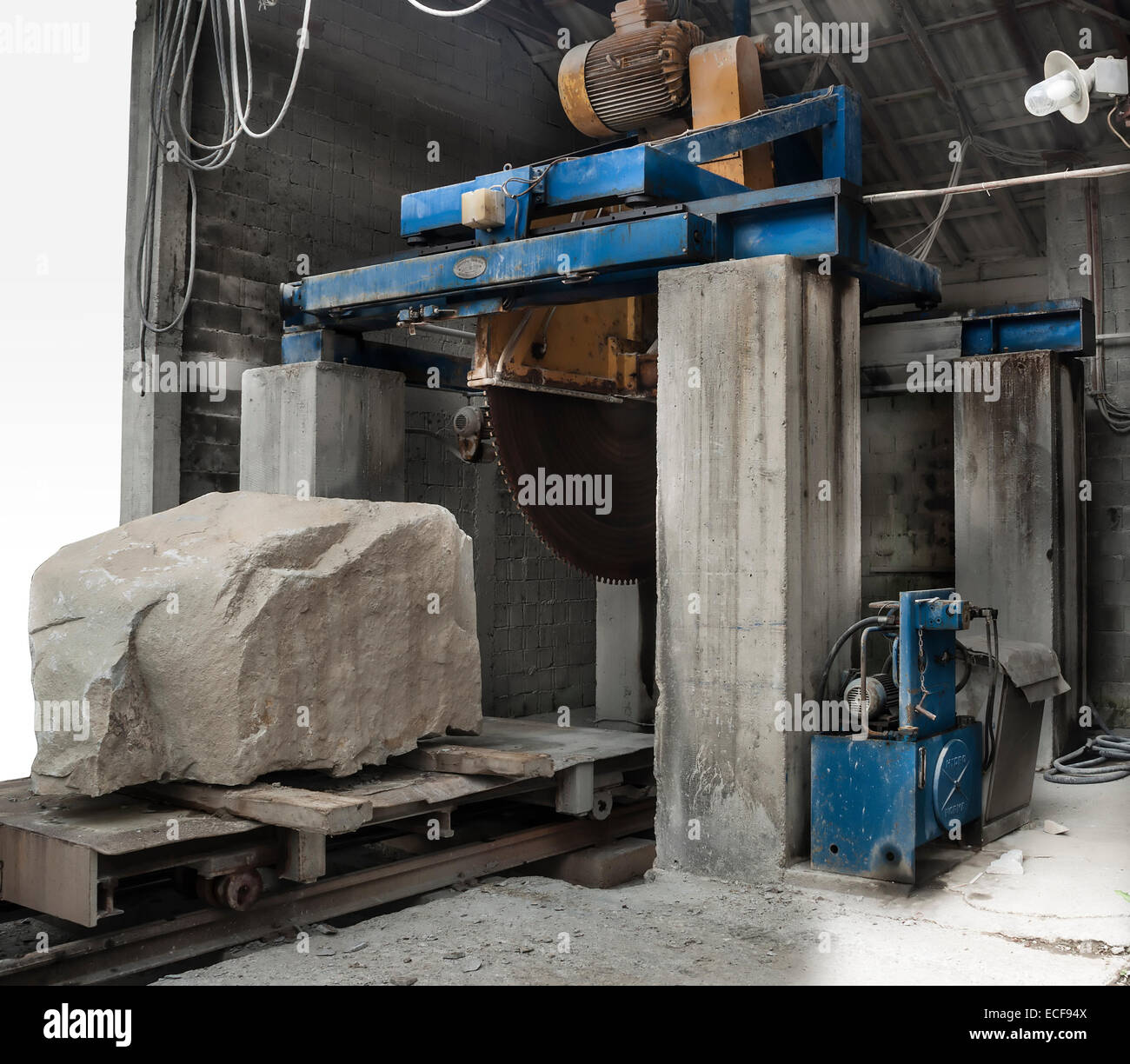 cutting a stone with a circular saw, motion blur on saw and cooling ...