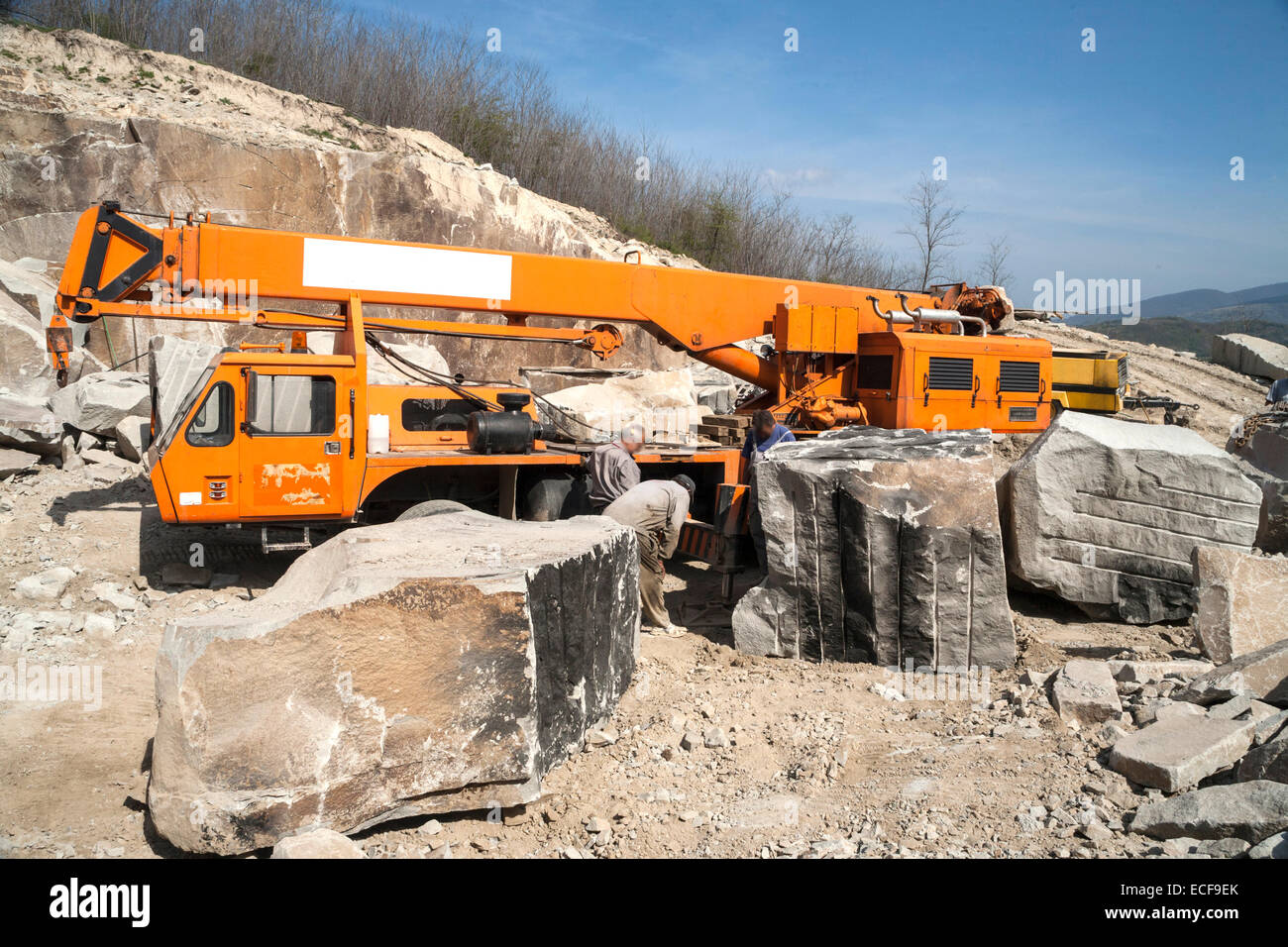 Granite quarry. Working mining machines. Mining industry Stock Photo ...