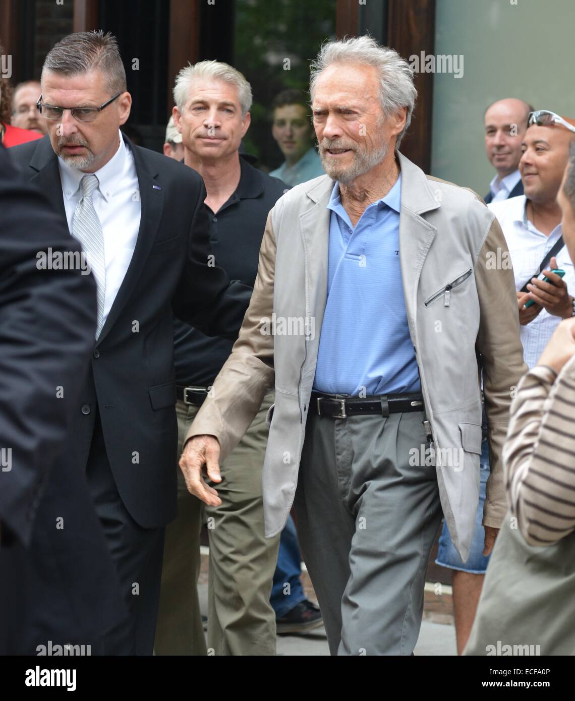 Clint Eastwood signs autographs as he leaves his hotel in Manhattan ...